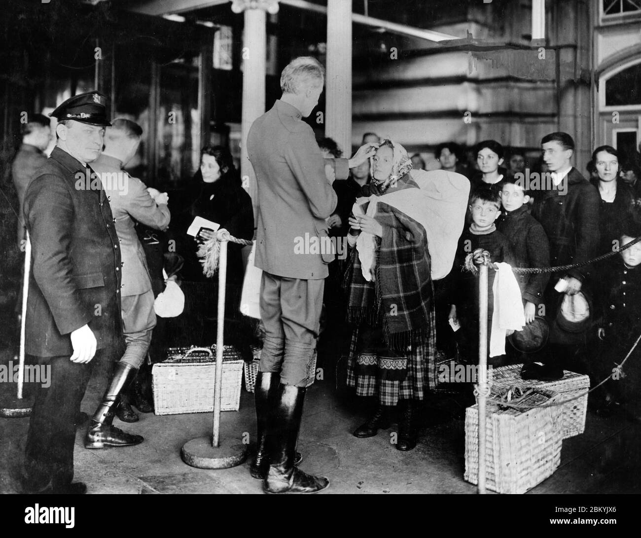 Public Health Service officers examining immigrants arriving at Ellis ...