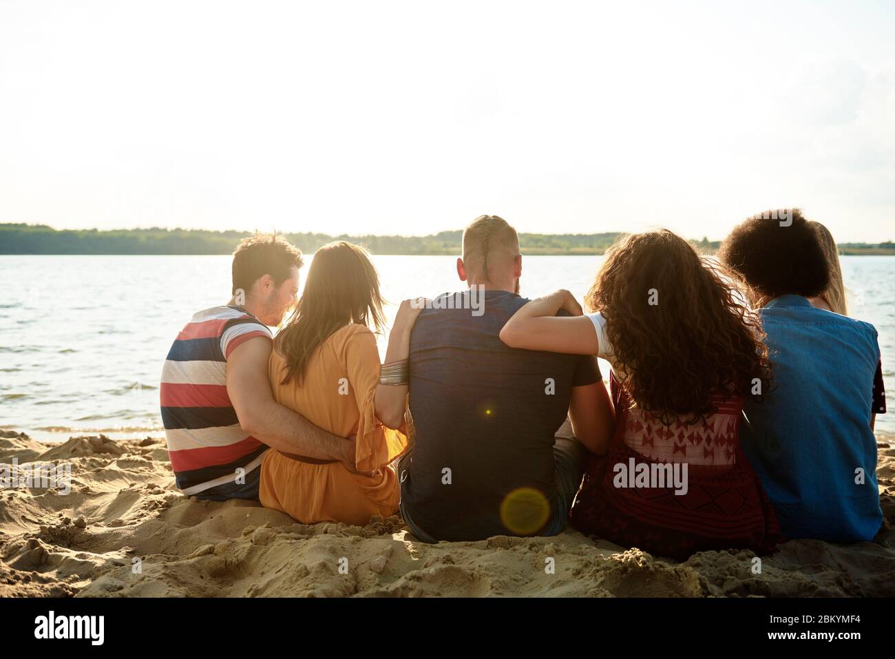 Rear view of young people chilling outside Stock Photo - Alamy