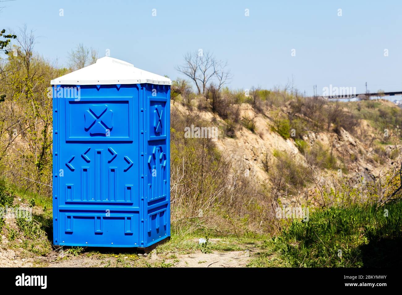 Blue Cabine Of Bio Toilet In a Mountain Park at sunny Summer Day Stock ...