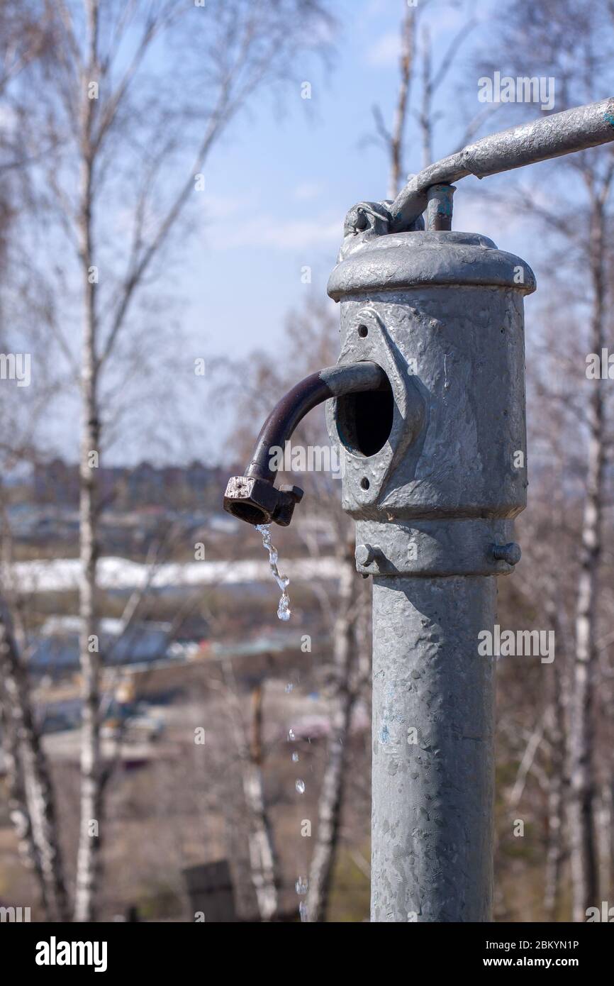 Turned off old village water column with dripping remaining water ...