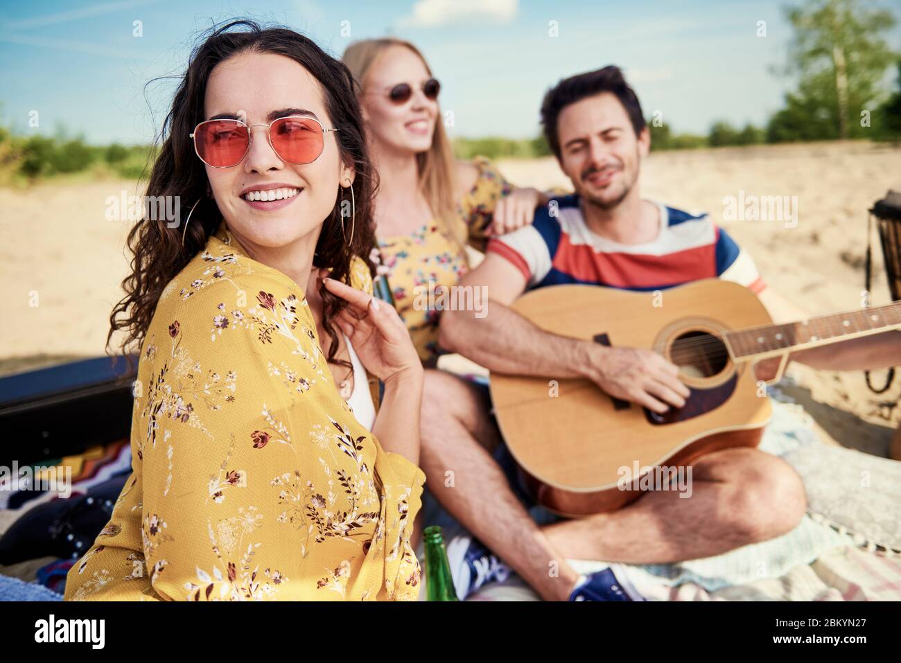 Beautiful woman chilling outdoors with best friends Stock Photo - Alamy
