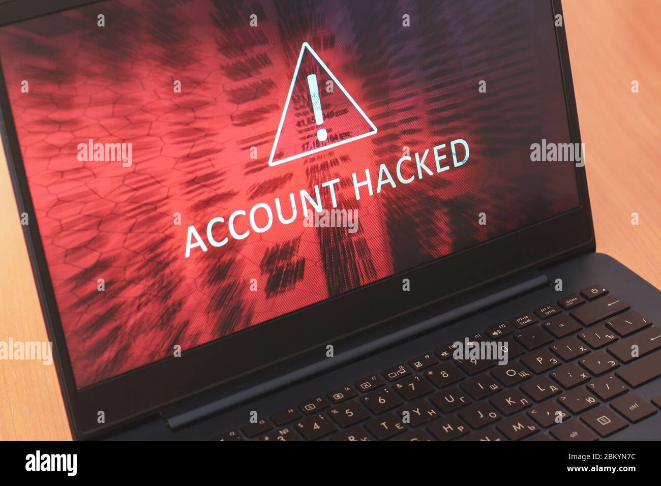 Laptop screen concept with white text Account hacked on red abstract ...
