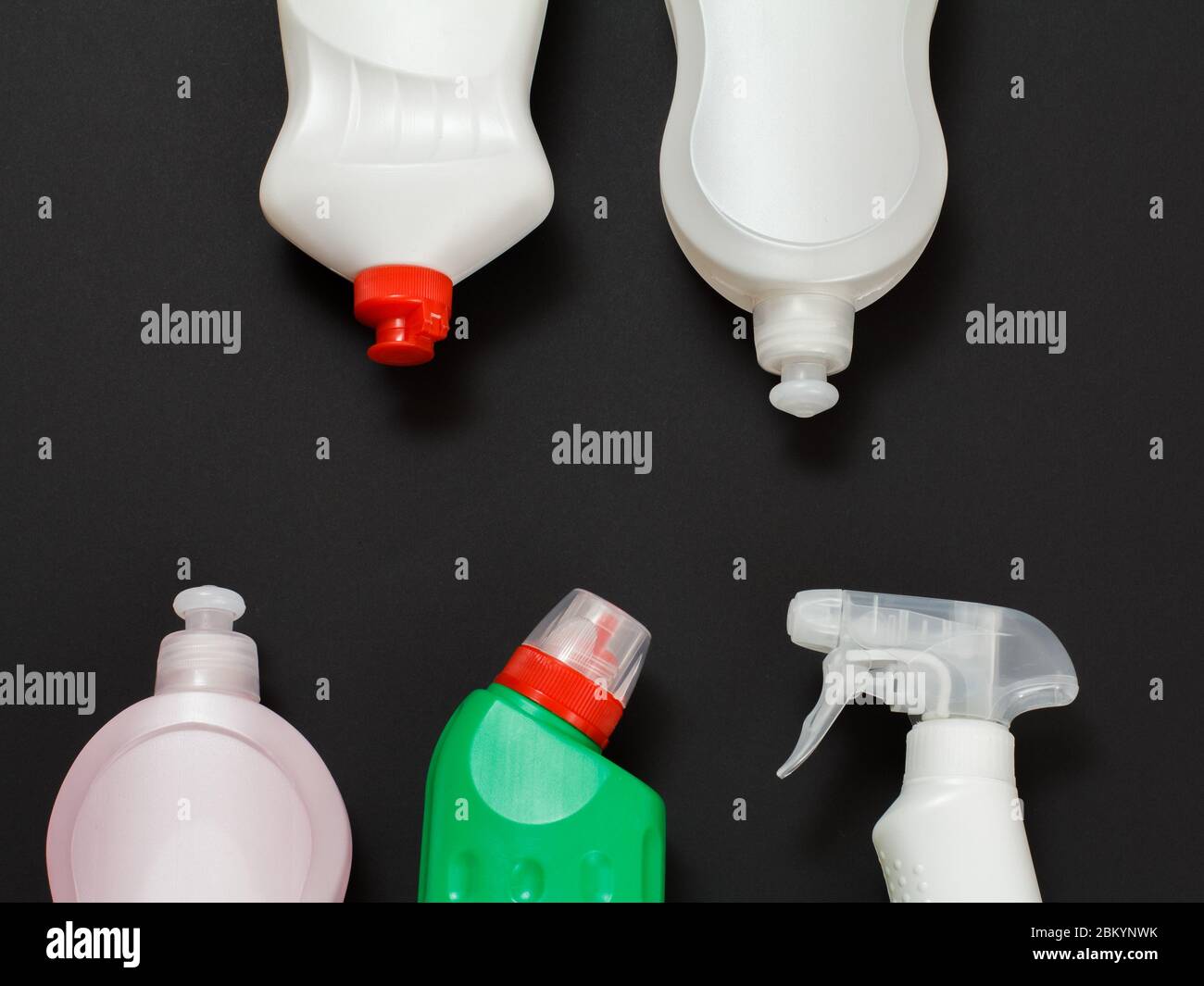 Bottles of washing and cleaning liquids on the black background. Top ...
