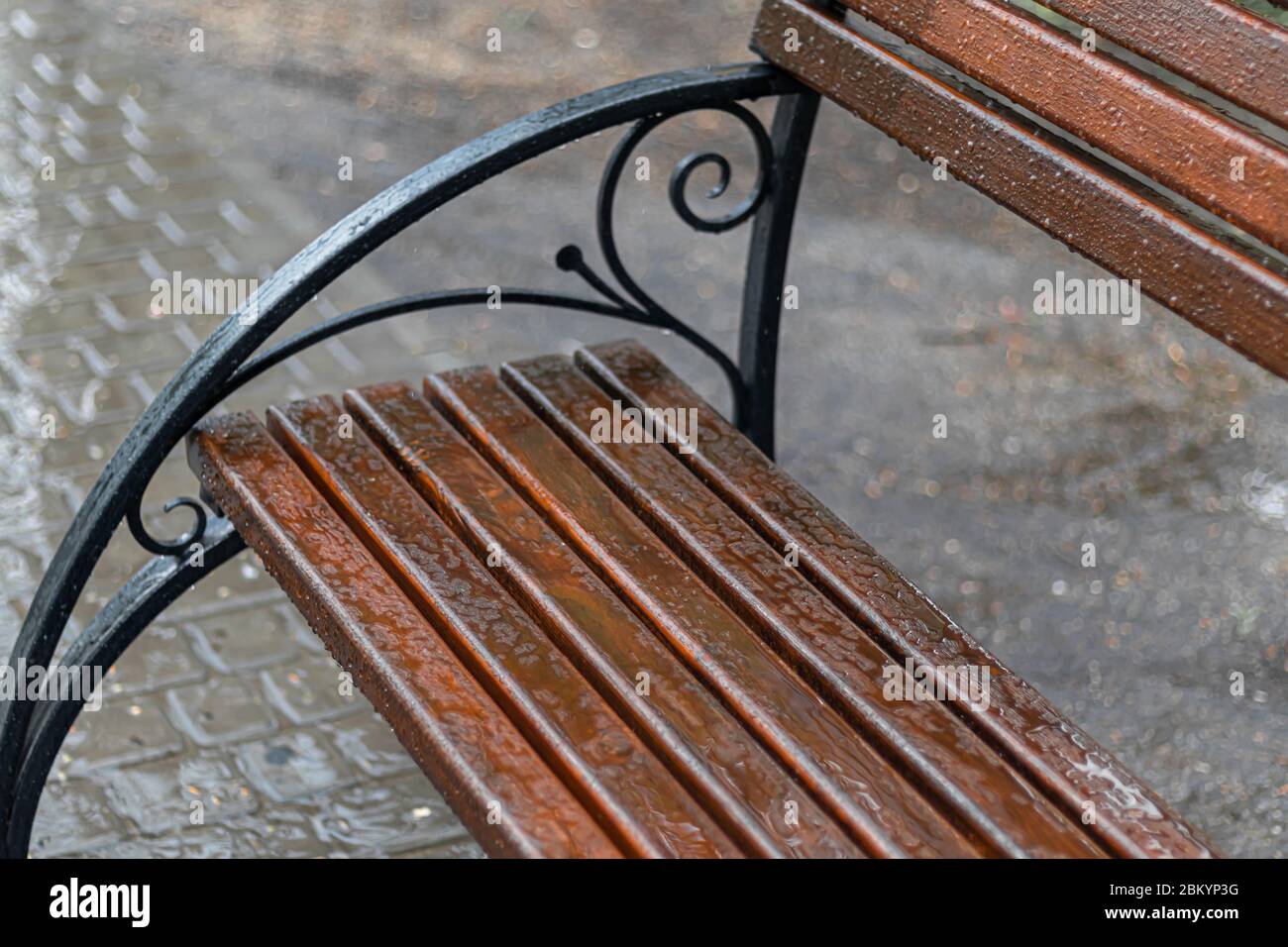 Empty swing at the playground in the rain. Children's swing in the park ...