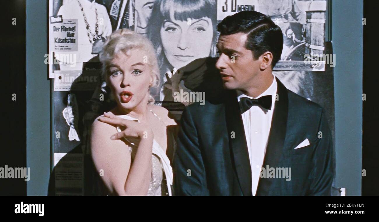 USA. Marilyn Monroe and Frankie Vaughan in a scene from the ©Twentieth ...