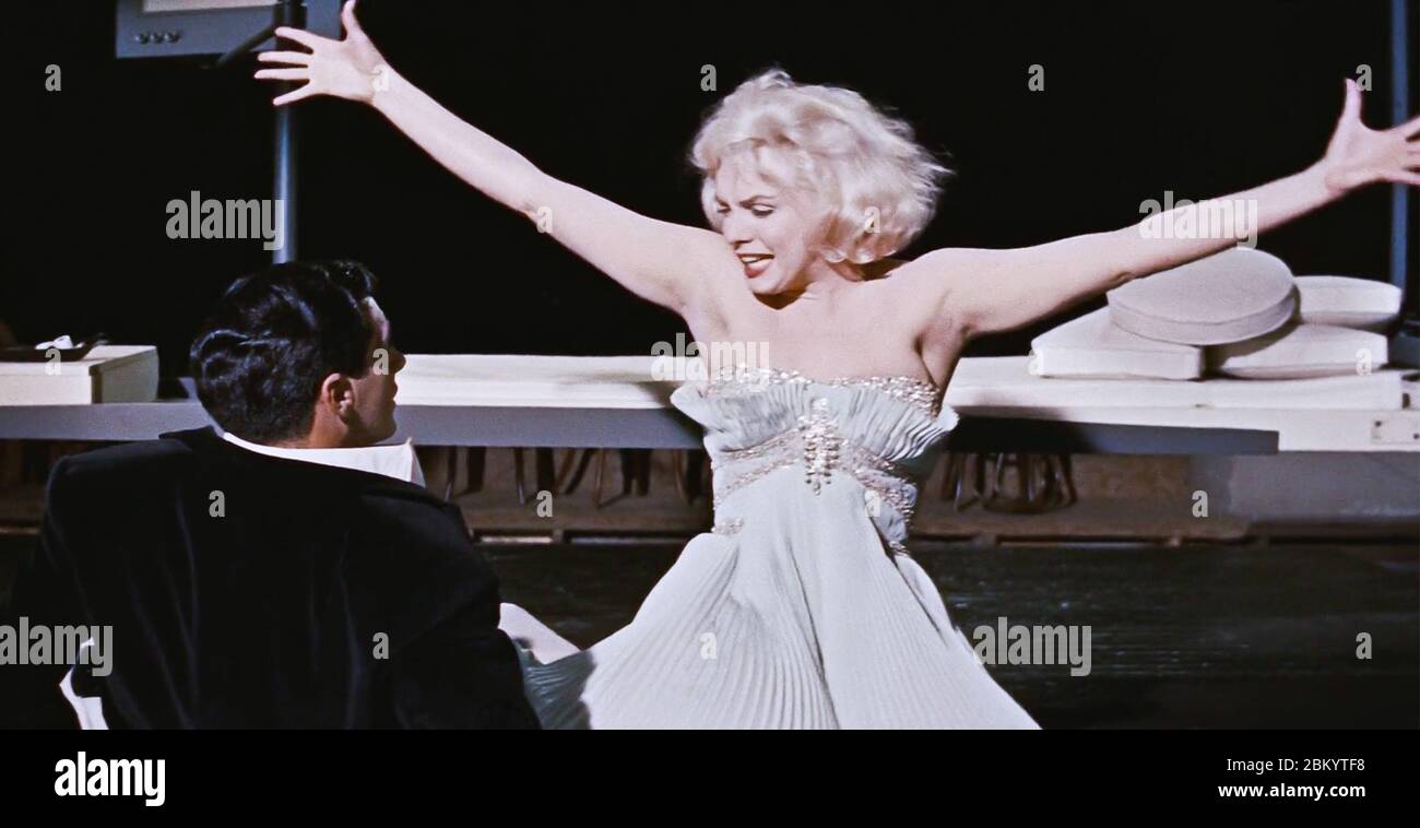 USA. Marilyn Monroe and Frankie Vaughan in a scene from the ©Twentieth ...