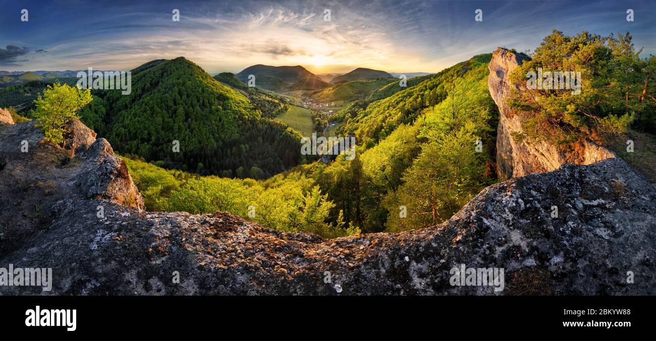 Rocks and forest landscape at dramatic sunset, spring time Stock Photo ...