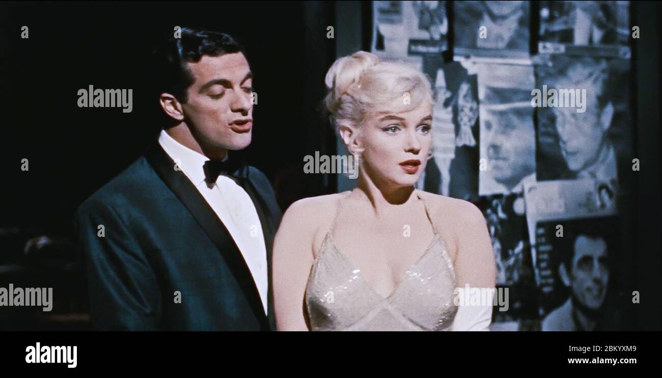 USA. Marilyn Monroe and Frankie Vaughan in a scene from the ©Twentieth ...