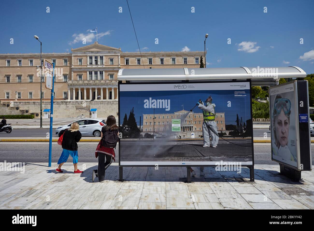 Bus station at Greek Parliament with coronavirus sign. Athens Greece ...