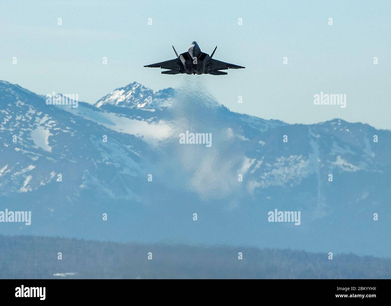 A U.S. Air Force F-22 Raptor flies over Joint Base Elmendorf-Richardson ...