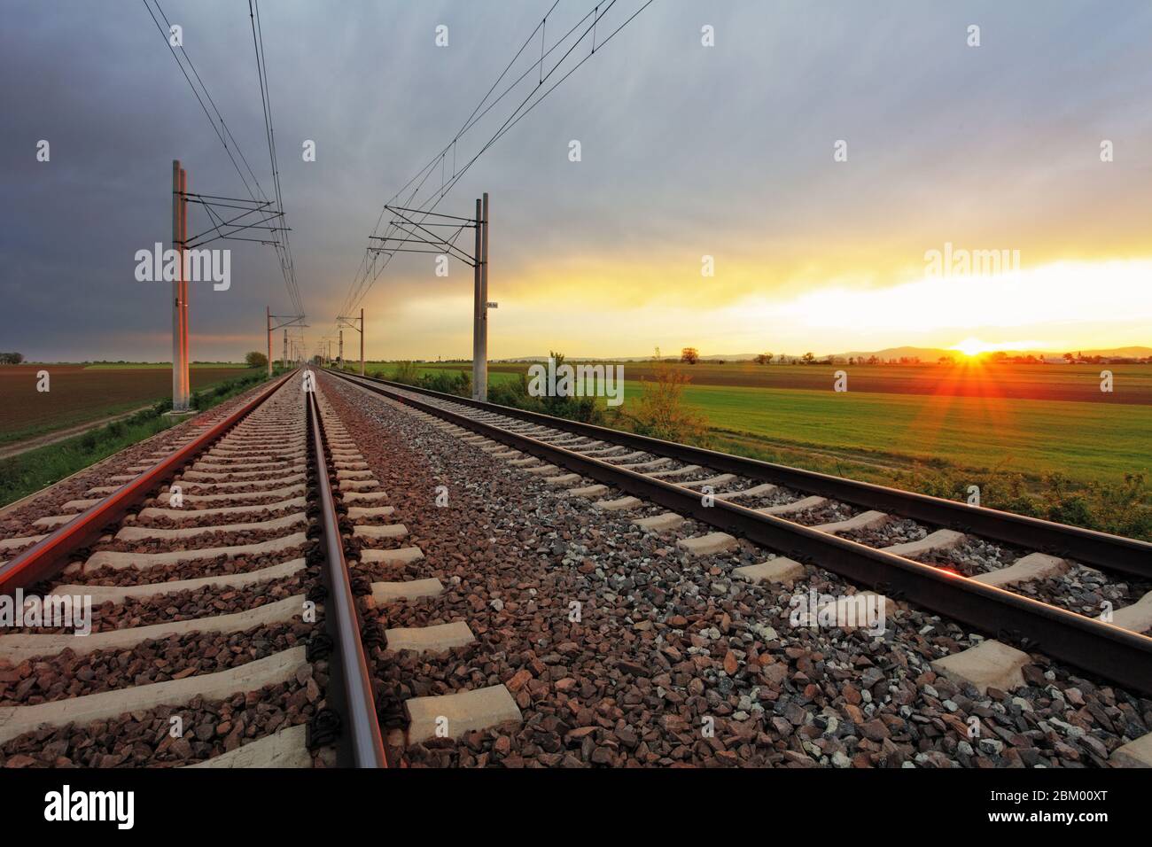 Railroad at sunset Stock Photo - Alamy