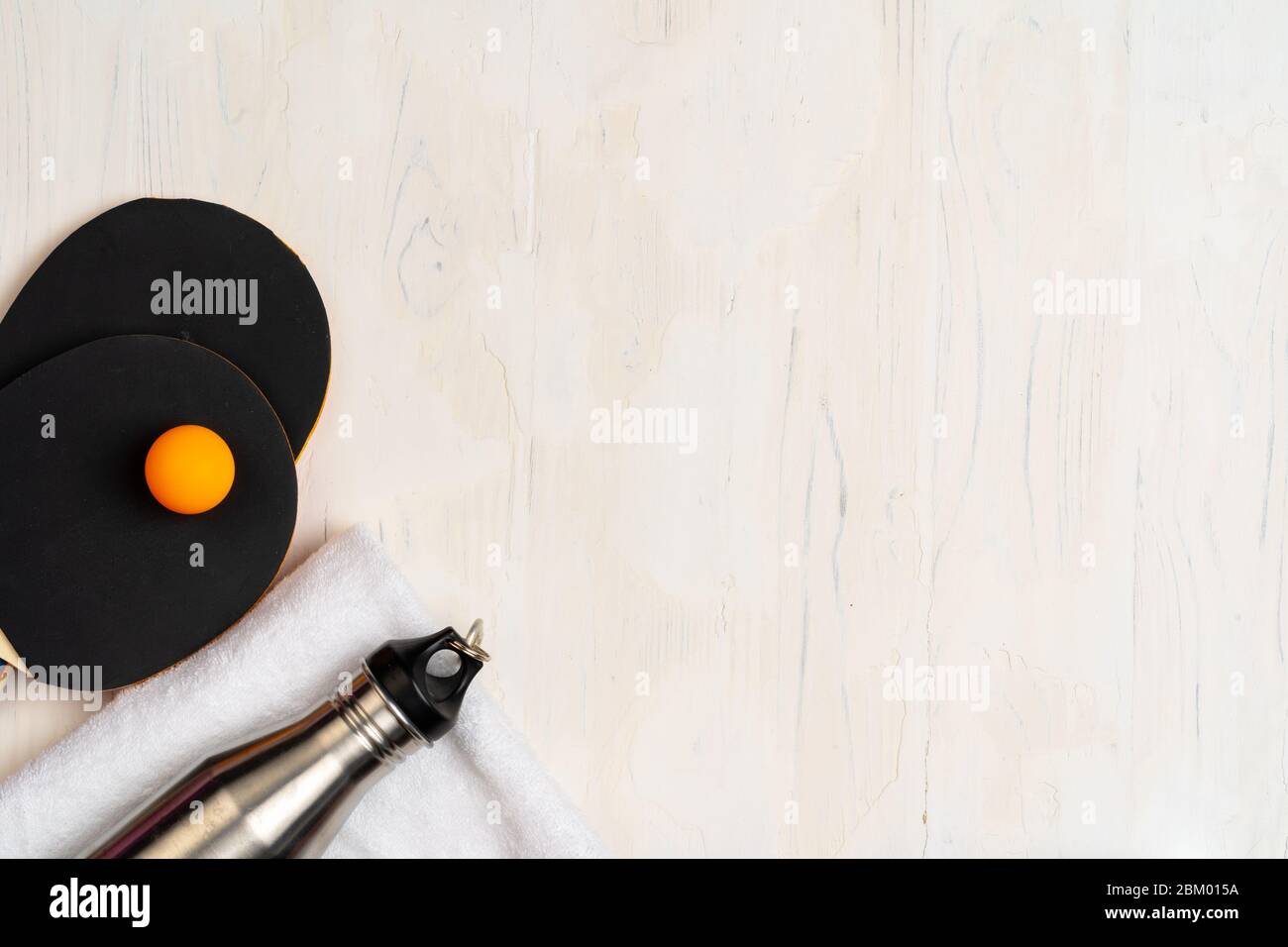 Ping pong equipment. Two rackets and ball, top view Stock Photo - Alamy