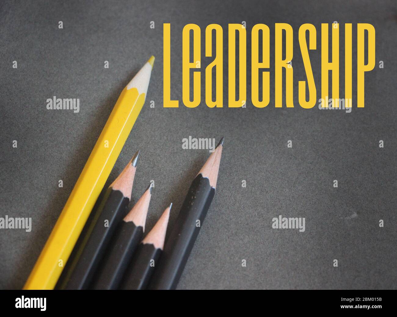 leadership word in yellow letters on blackb and pencils besides. Team ...