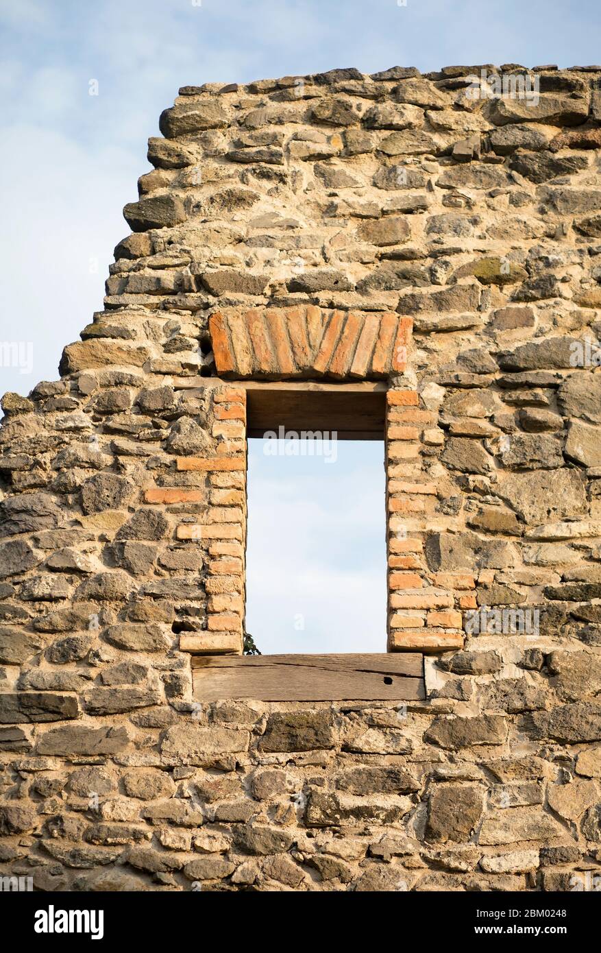 Brick frame window with sky of an old stone wall Stock Photo - Alamy
