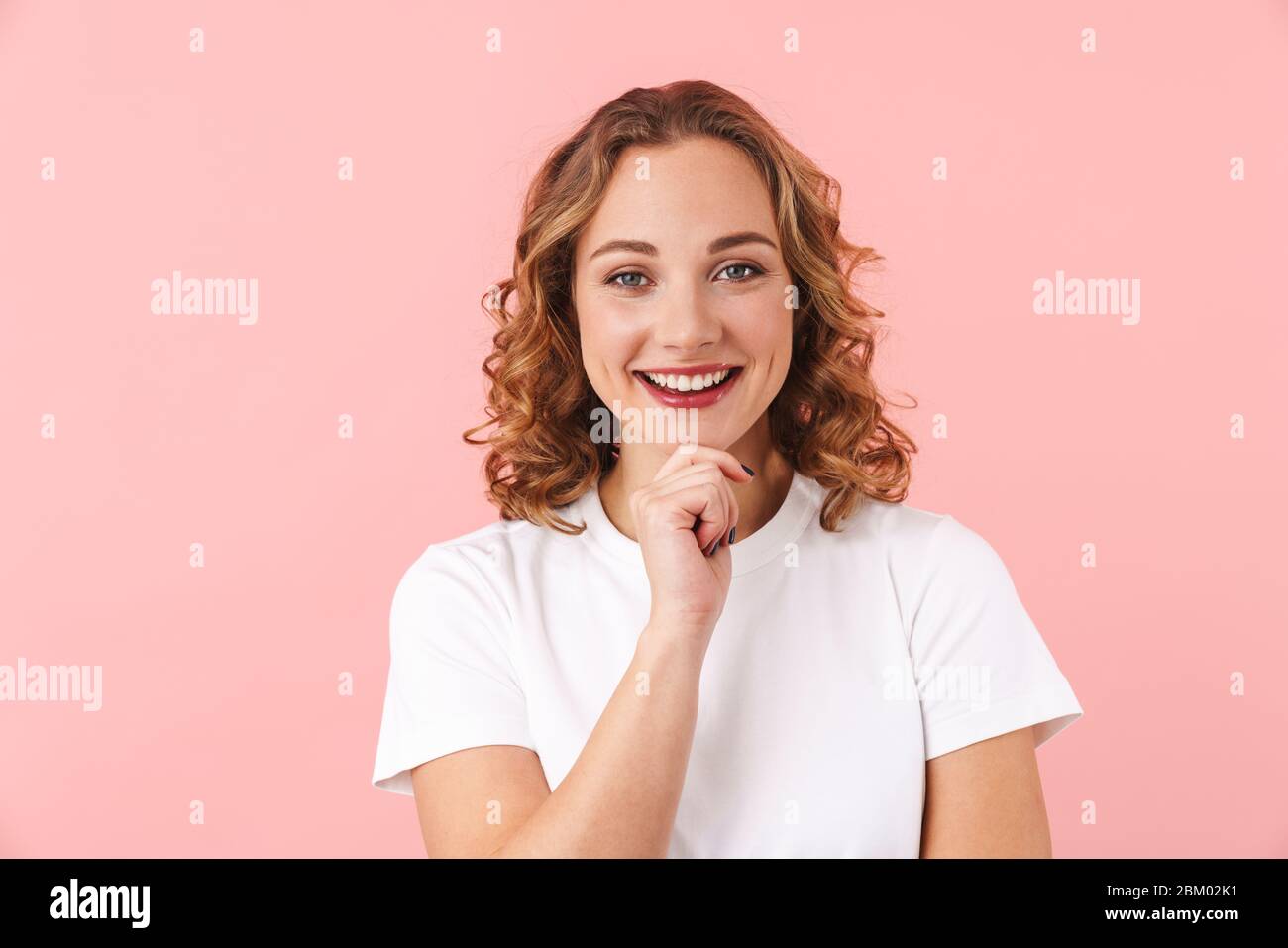 Image of a cheerful optimistic young pretty woman posing isolated over ...