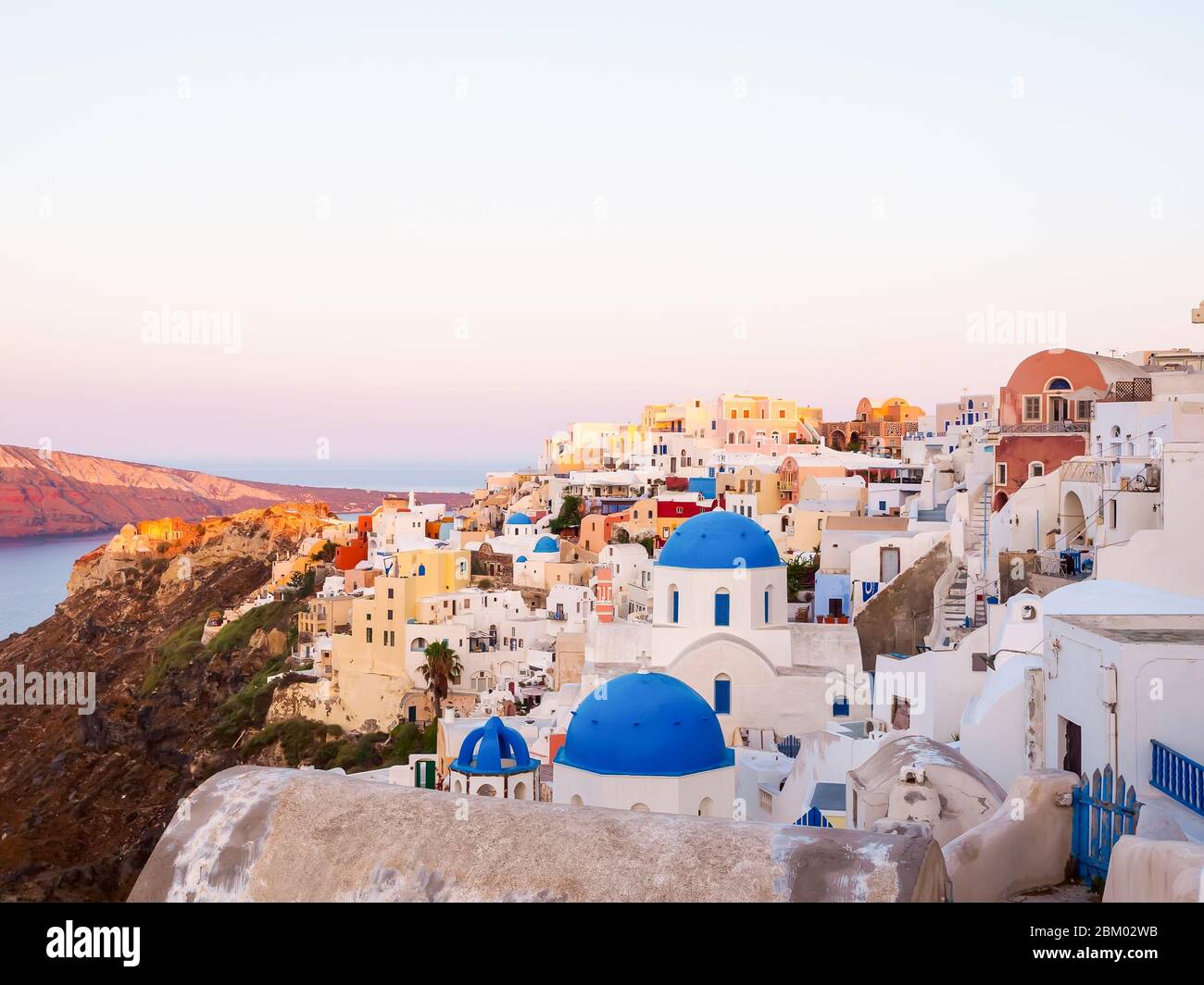 Amazing sunrise Santorini view with cave houses. Santorini island ...