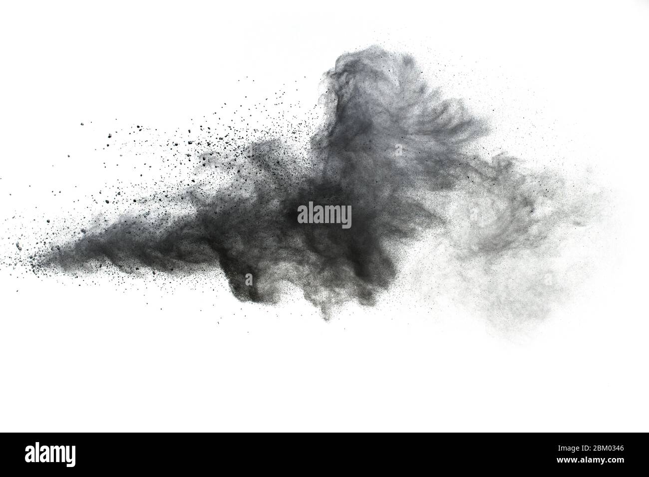 Black powder explosion.The particles of charcoal splash on white ...