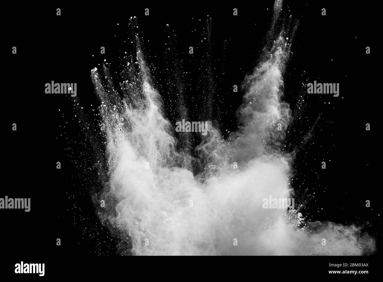 White powder explosion isolated on black background.White dust ...