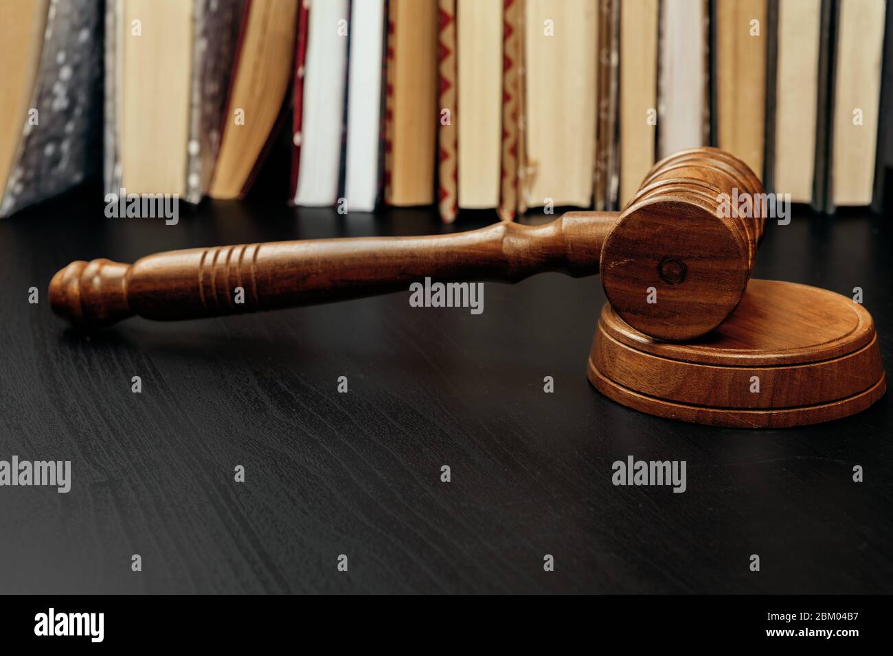 Judge's gavel on wooden table in dark Stock Photo - Alamy