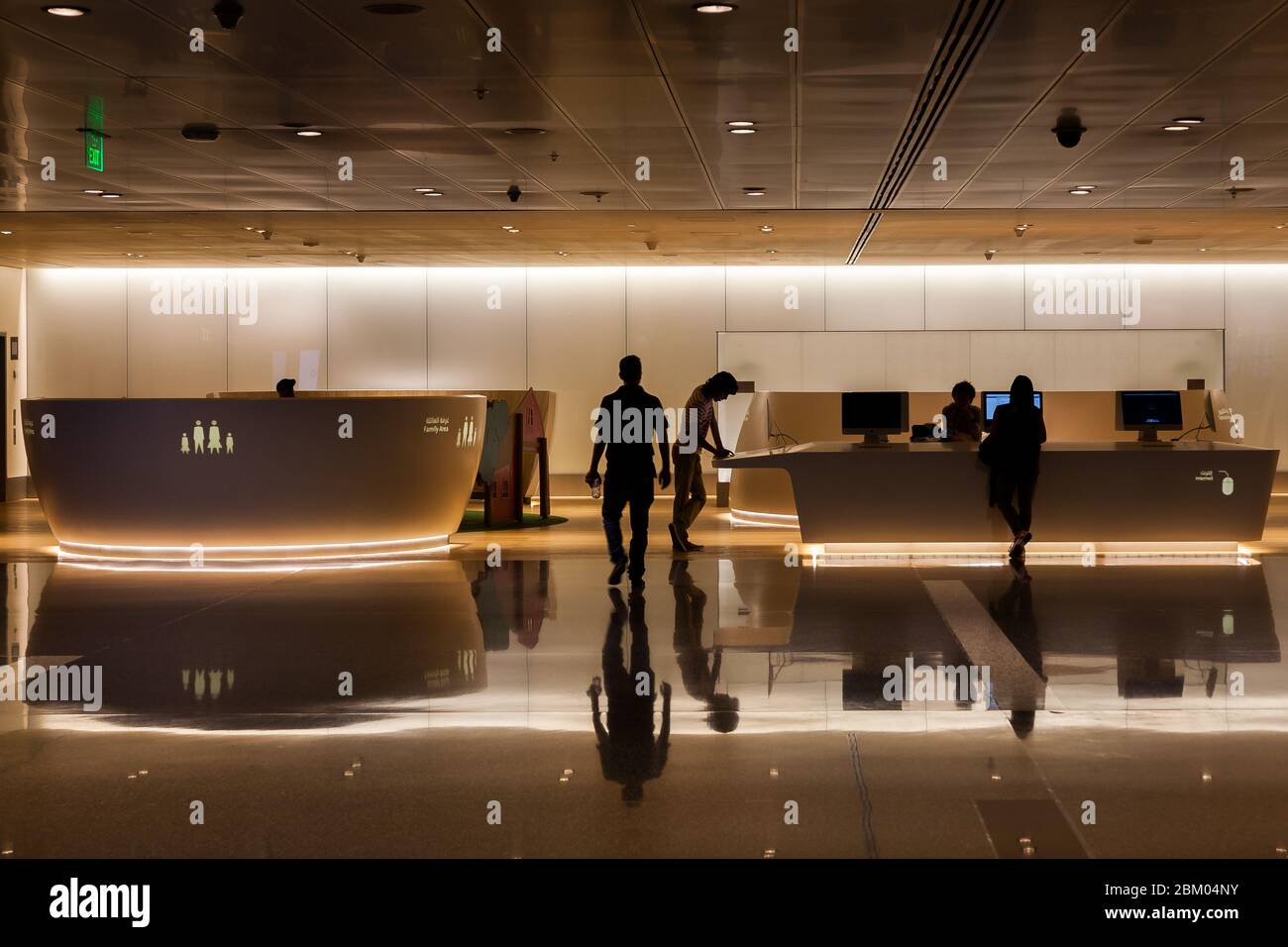 Travellers using computers at an Internet service counter in Hamad ...