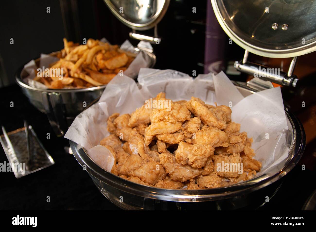 Fried chicken and french fries on a buffet tray Stock Photo - Alamy