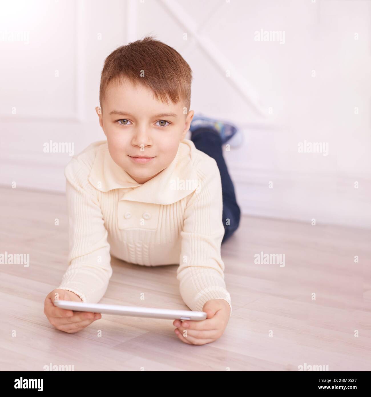 Little boy. Modern training. Bright interior. Vertical Stock Photo - Alamy