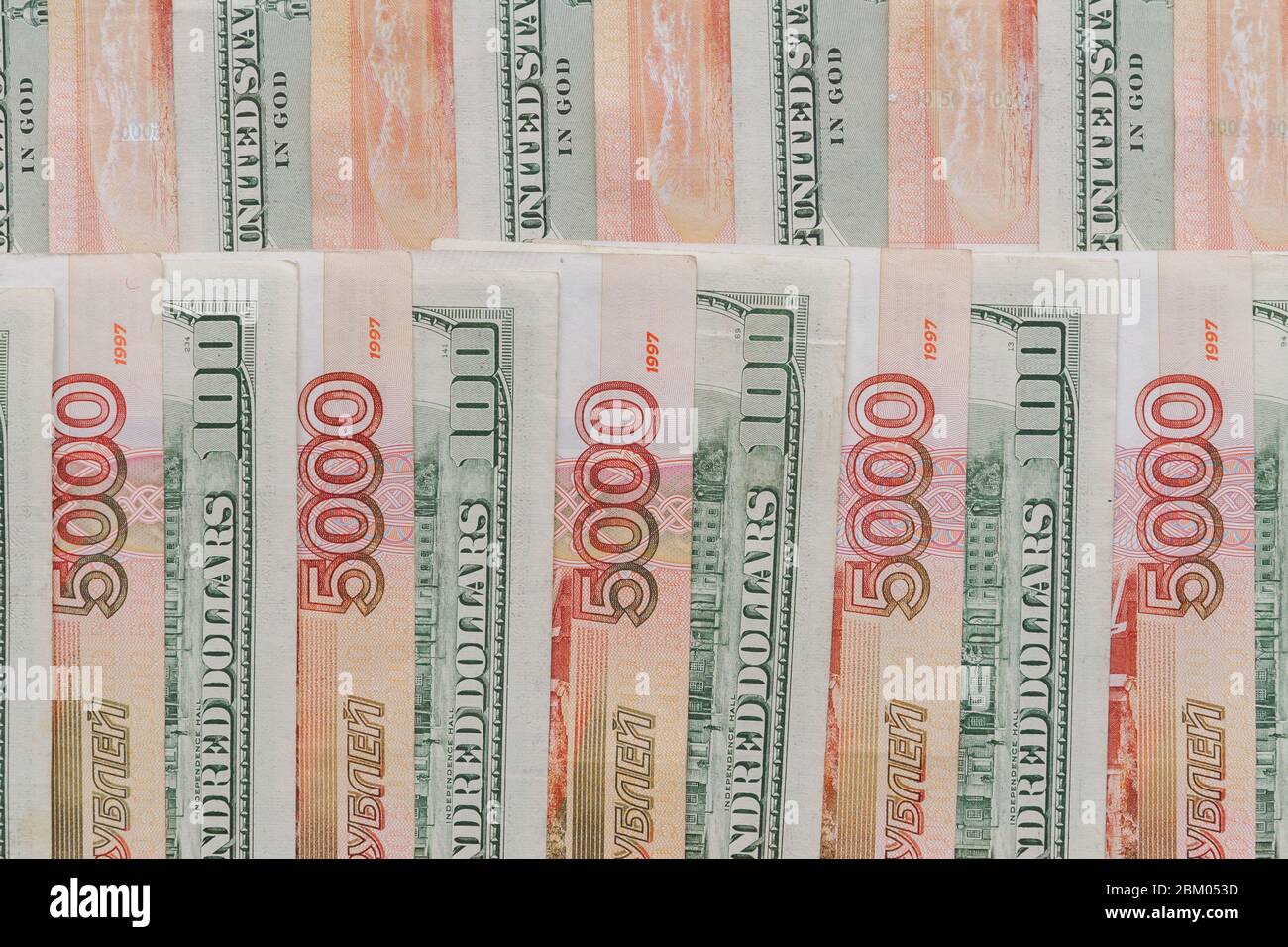 A large number of American hundred dollar bills and Russian five ...