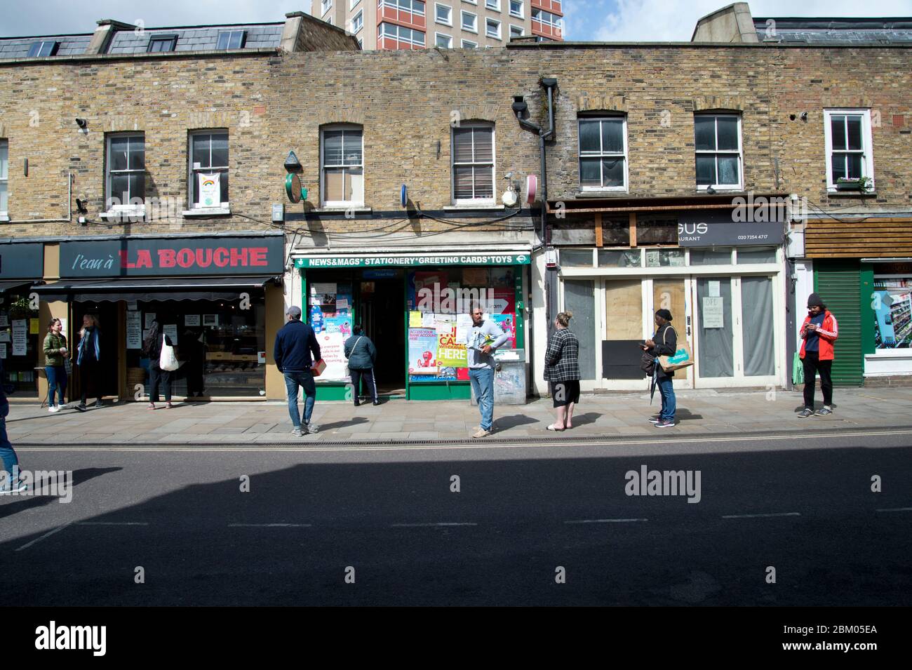 London May 2020 The Covid-19 pandemic. Broadway market, Hackney. Queue ...