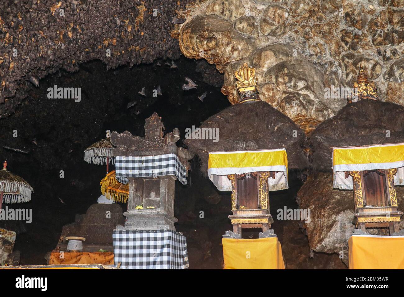 Altars at Pura Goa Lawah or Bat Cave Temple. Balinese Hindu temple in ...