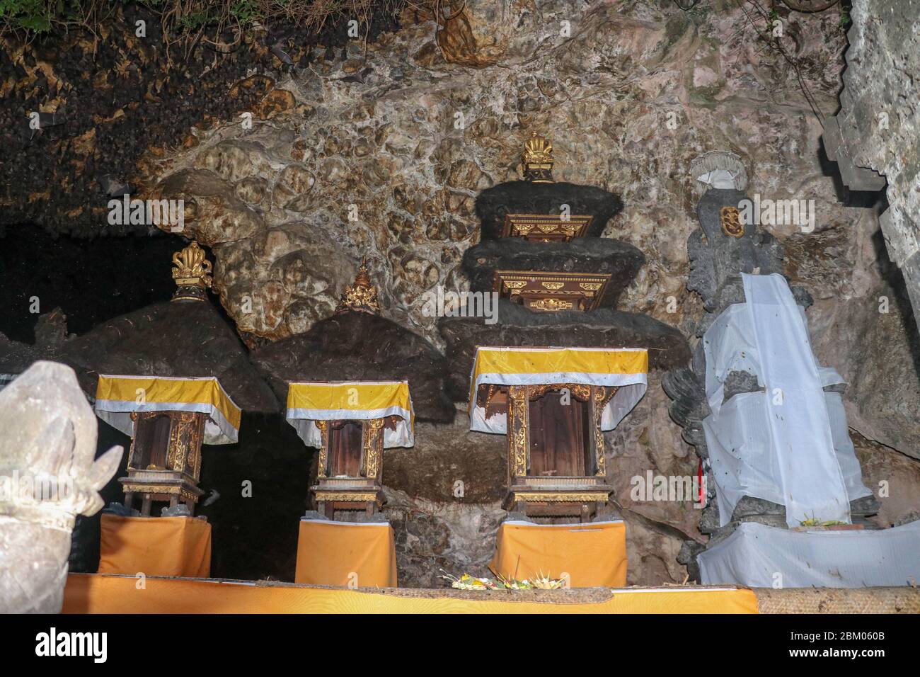 Altars at Pura Goa Lawah or Bat Cave Temple. Balinese Hindu temple in ...