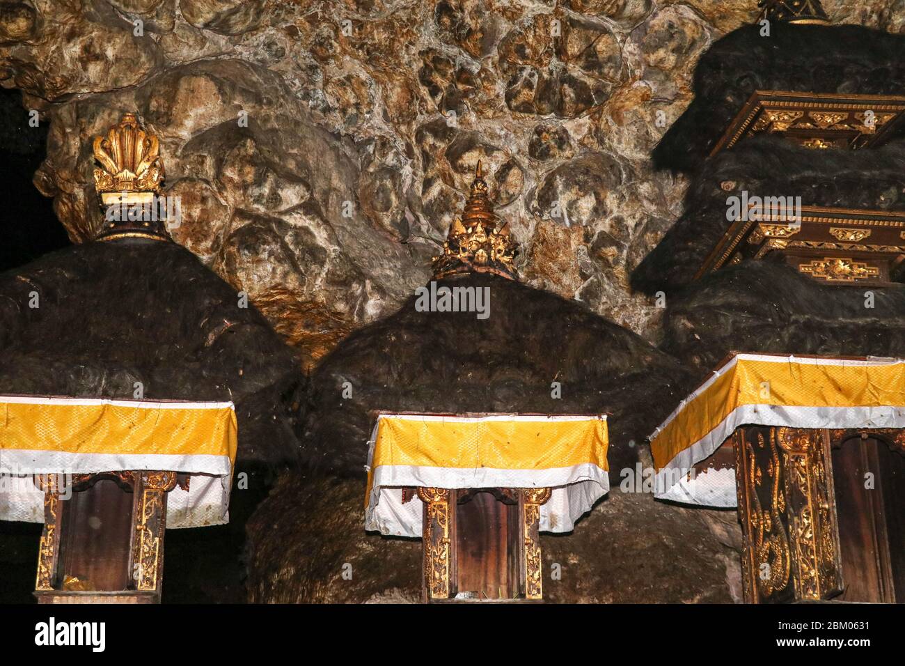 Altars at Pura Goa Lawah or Bat Cave Temple. Balinese Hindu temple in ...