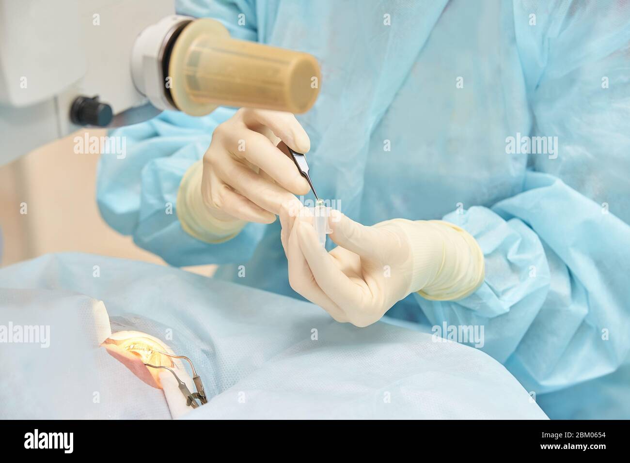 Ophthalmology laser microscope operation. Doctor in clinic. Patient eye ...