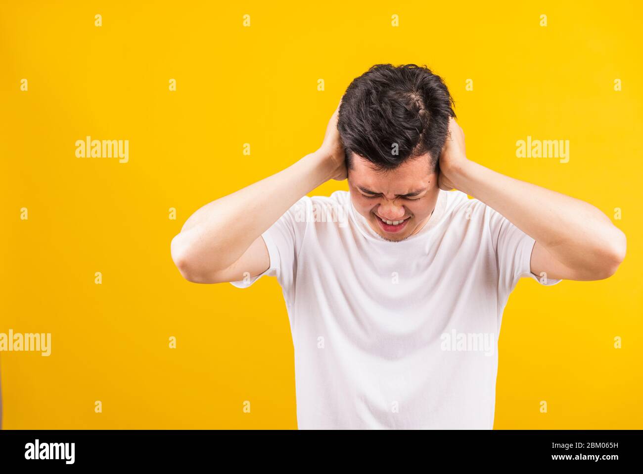 Portrait Aaian handsome young man standing wearing white t-shirt he ...