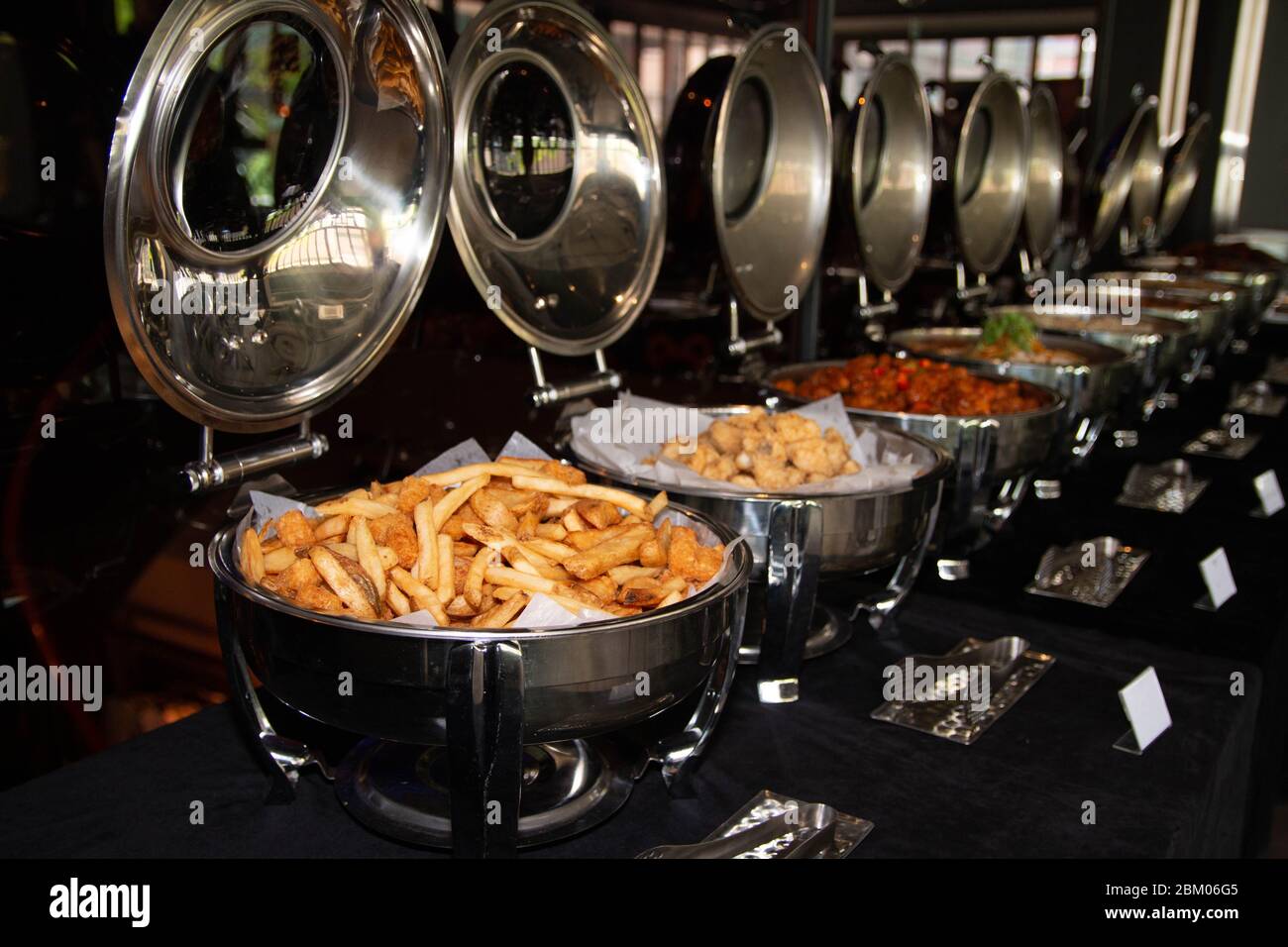 Foods inside a metal stainless steel restaurant buffet tray. French ...