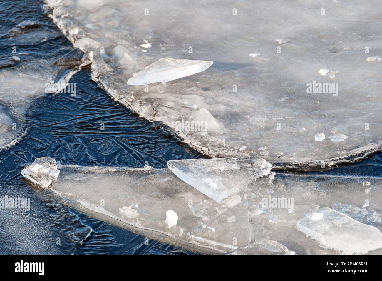 Transparent ice chunks on frozen water hi-res stock photography and ...