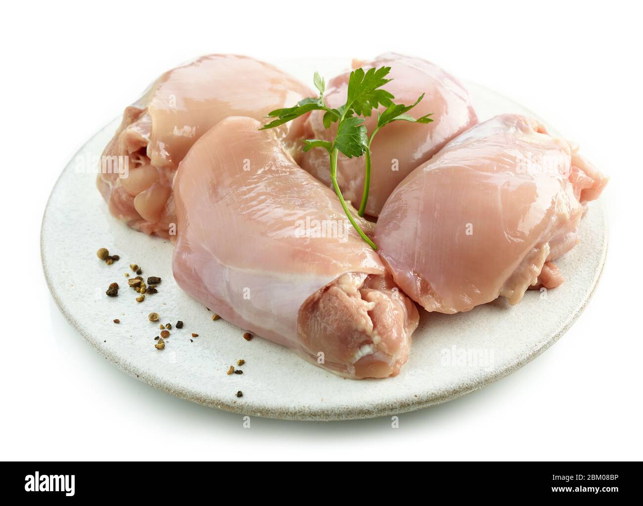 fresh raw chicken skinless boneless ham meat on white plate isolated on ...