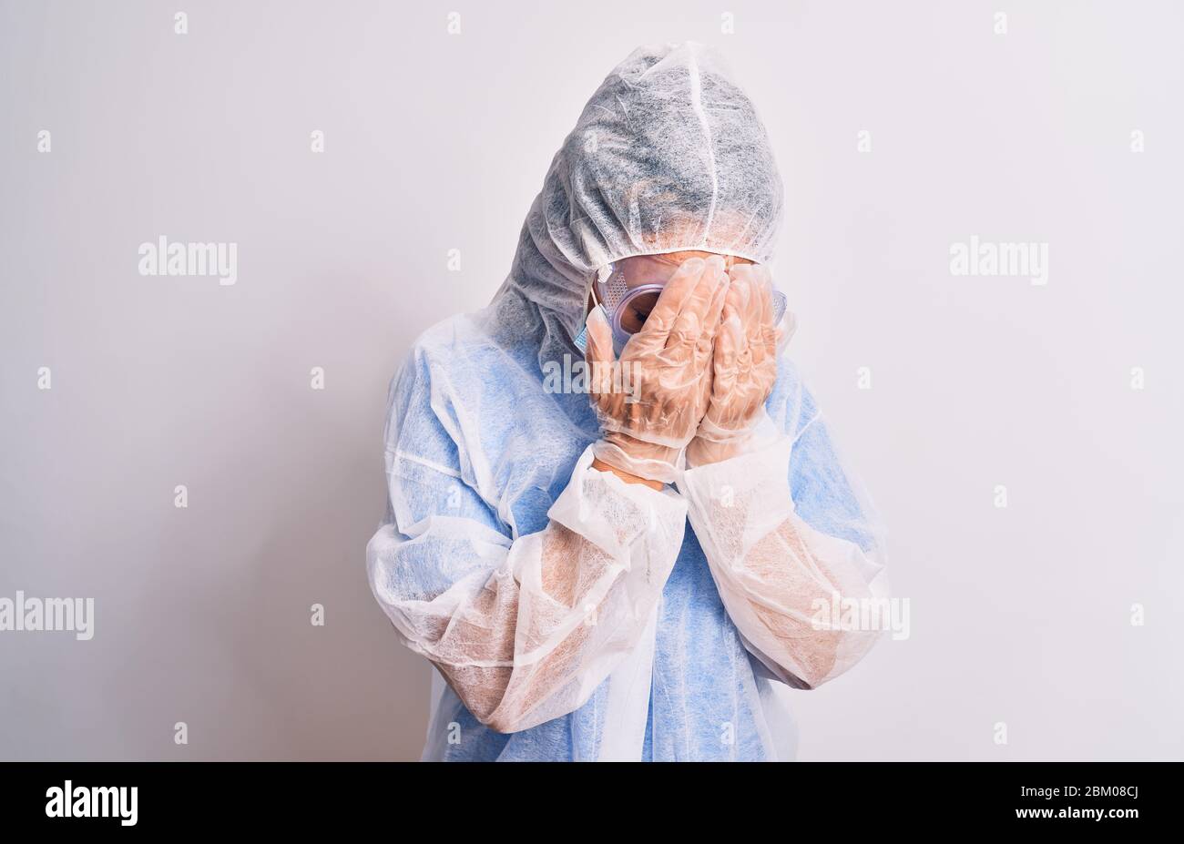 Middle age nurse woman wearing protection coronavirus equipment over ...