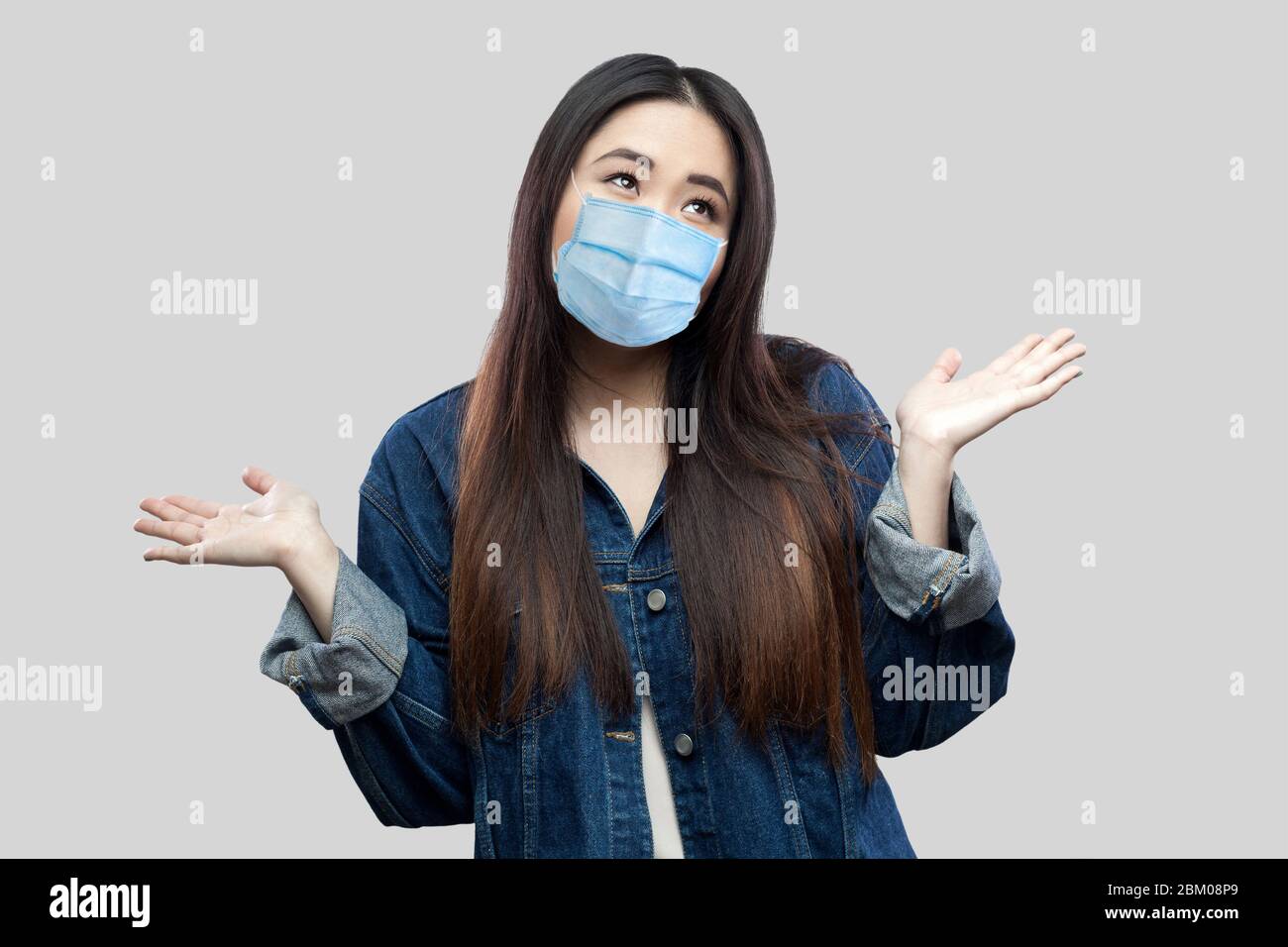 I don't know. Confused beautiful brunette asian young woman with ...