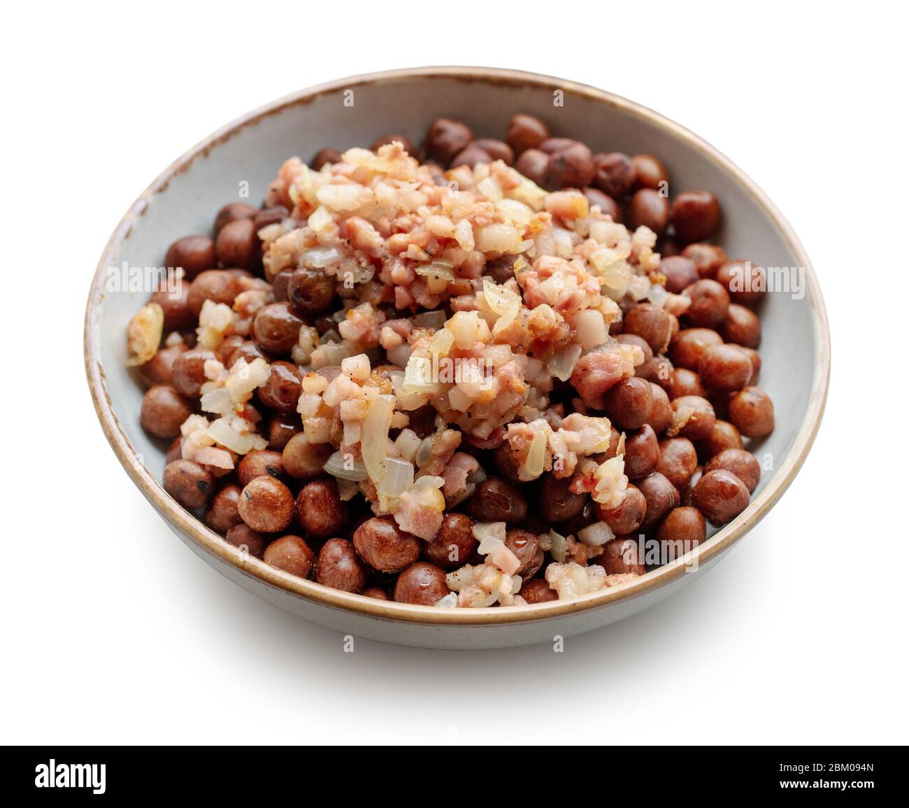 bowl of boiled gray peas with chopped bacon and onions isolated on ...