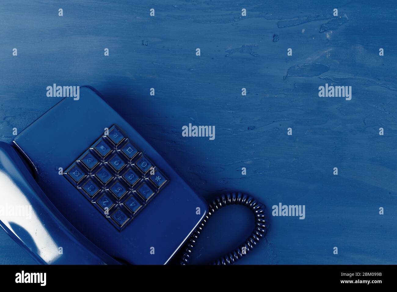 Retro telephone of blue color on classic blue background Stock Photo ...