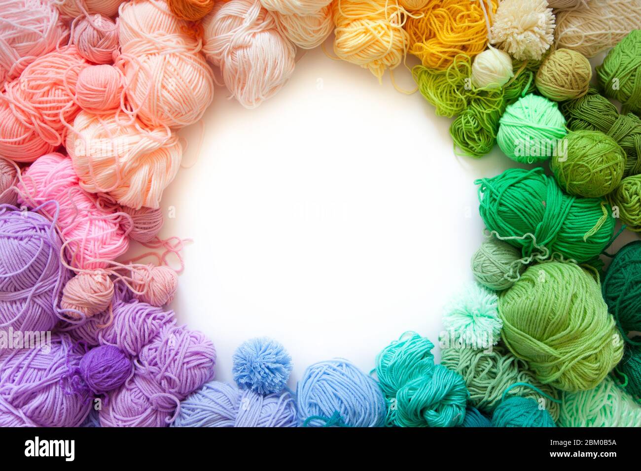 Color wheel of yarn. Rainbow and spectrum. White background. Threads of ...