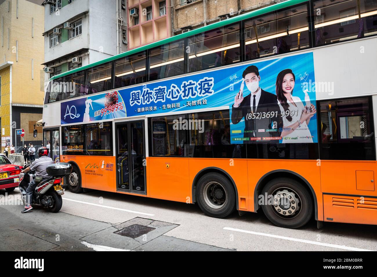 Hong Kong, 11 april 2020 Buses with advertisements for desinfectants to ...