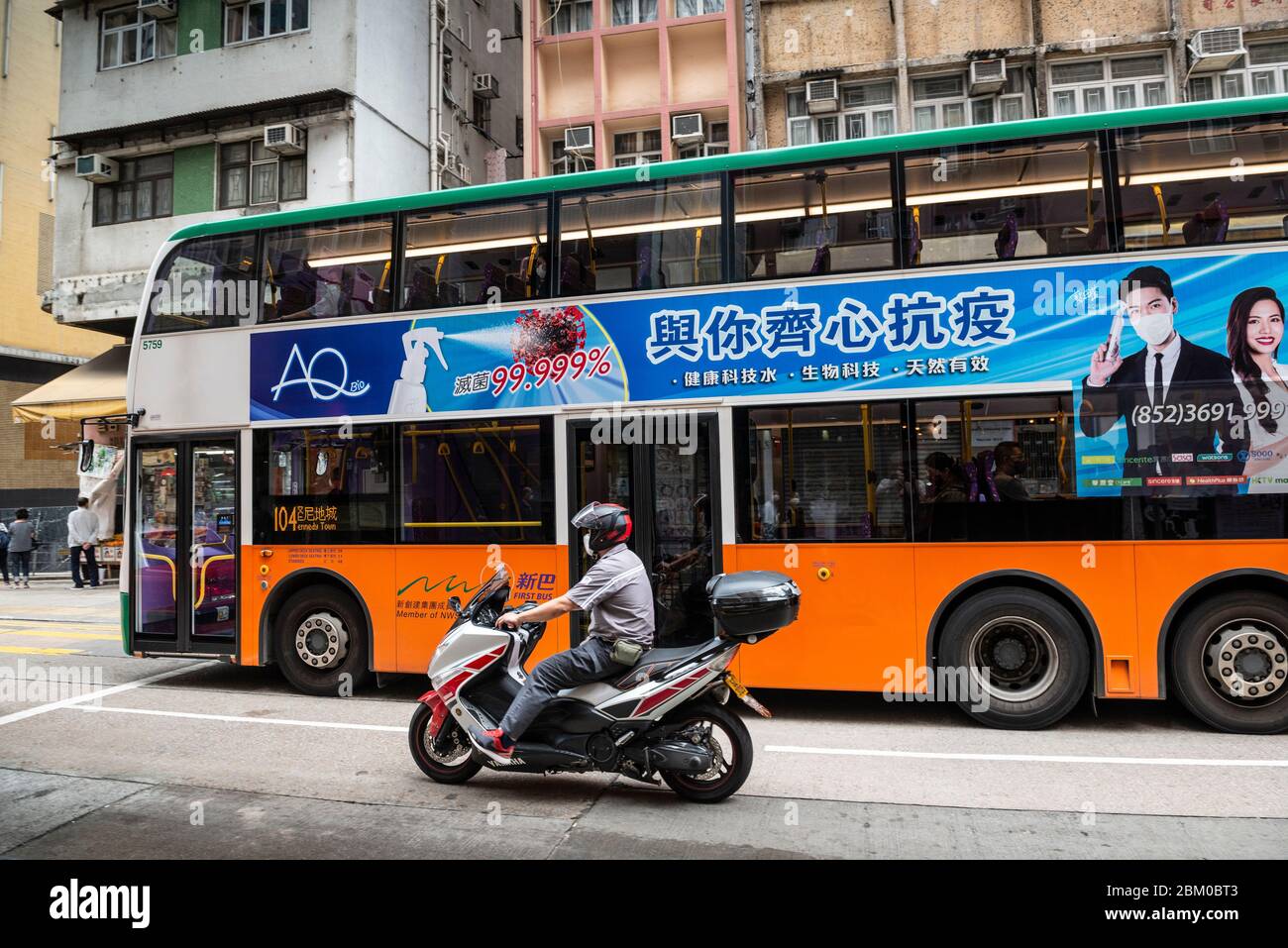 Hong Kong, 11 april 2020 Buses with advertisements for desinfectants to ...