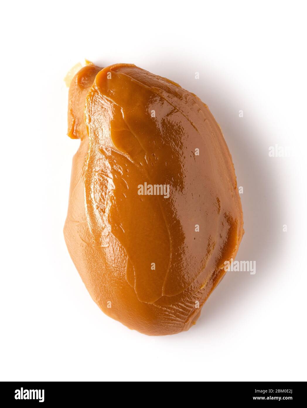 soft caramel isolated on white background, top view Stock Photo - Alamy