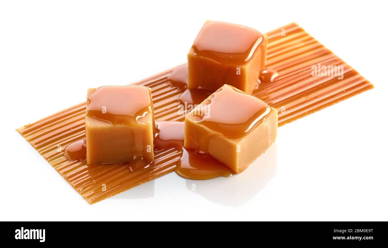 composition of caramel candies isolated on white background Stock Photo ...