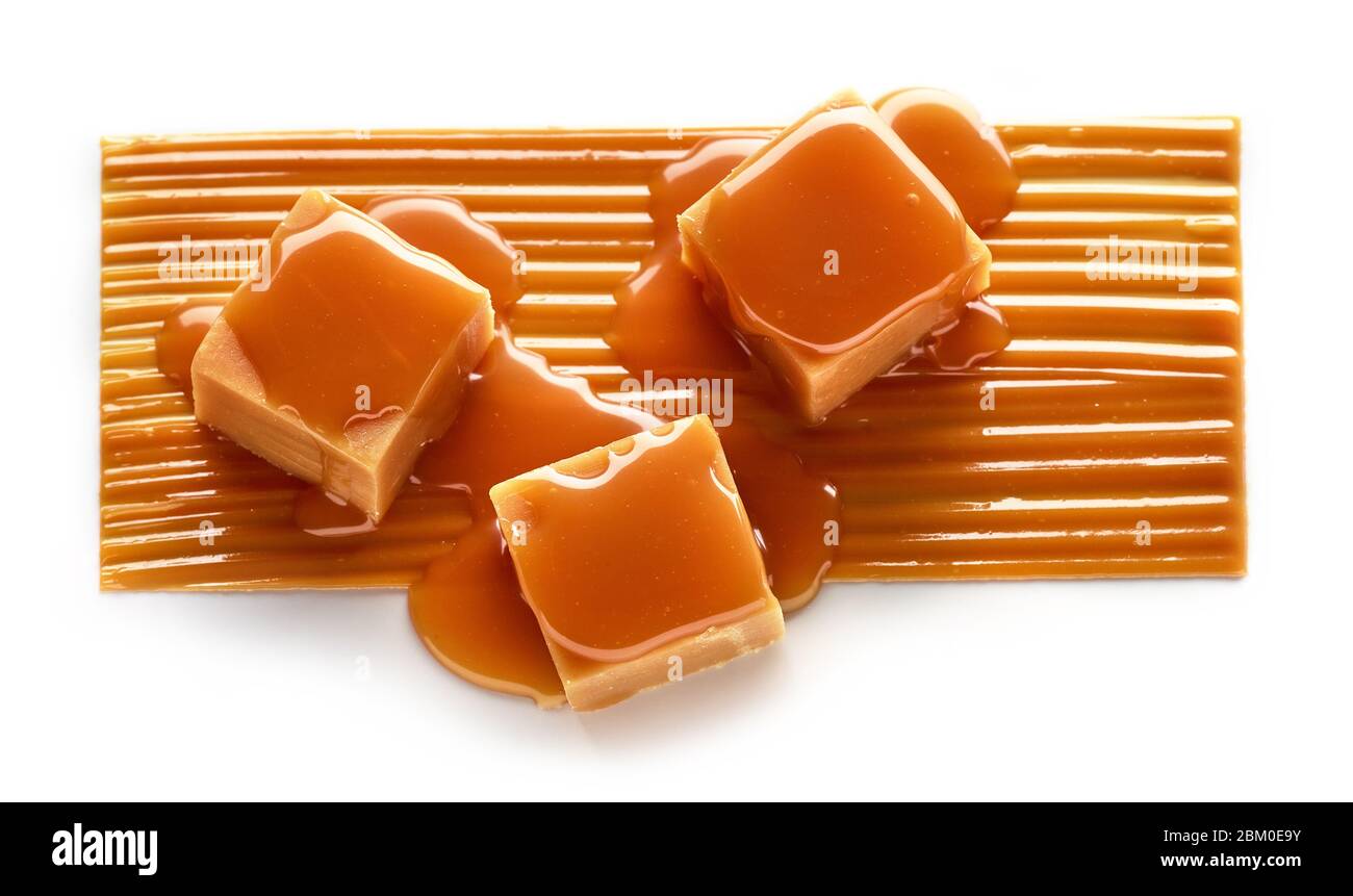 composition of caramel candies isolated on white background, top view ...