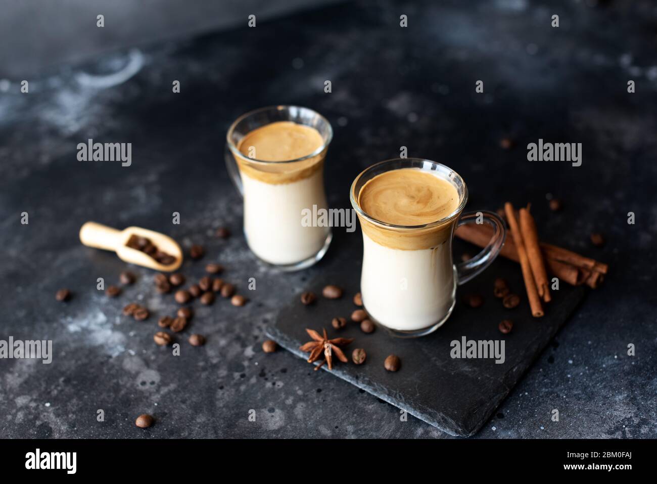 Two glass cups with Dalgona frothy coffee trend korean drink latte ...