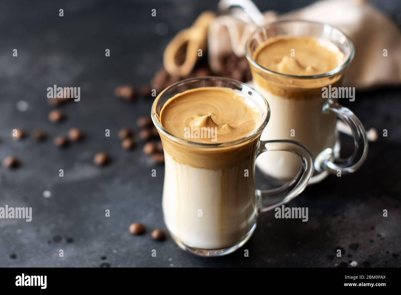 Two glass cups with Dalgona frothy coffee trend korean drink latte ...