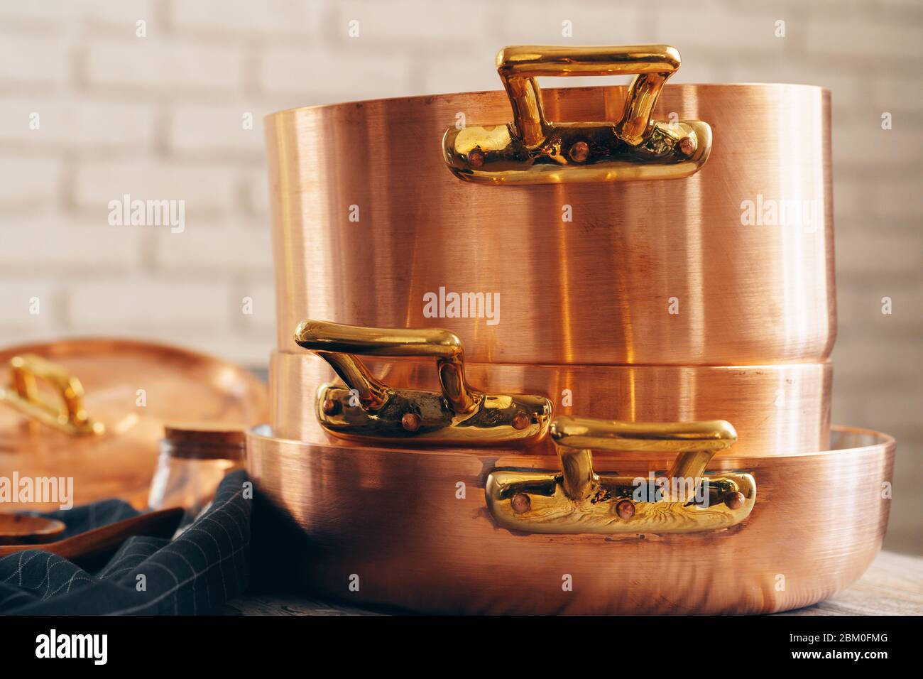 New copper cookware for professional kitchen close up Stock Photo - Alamy
