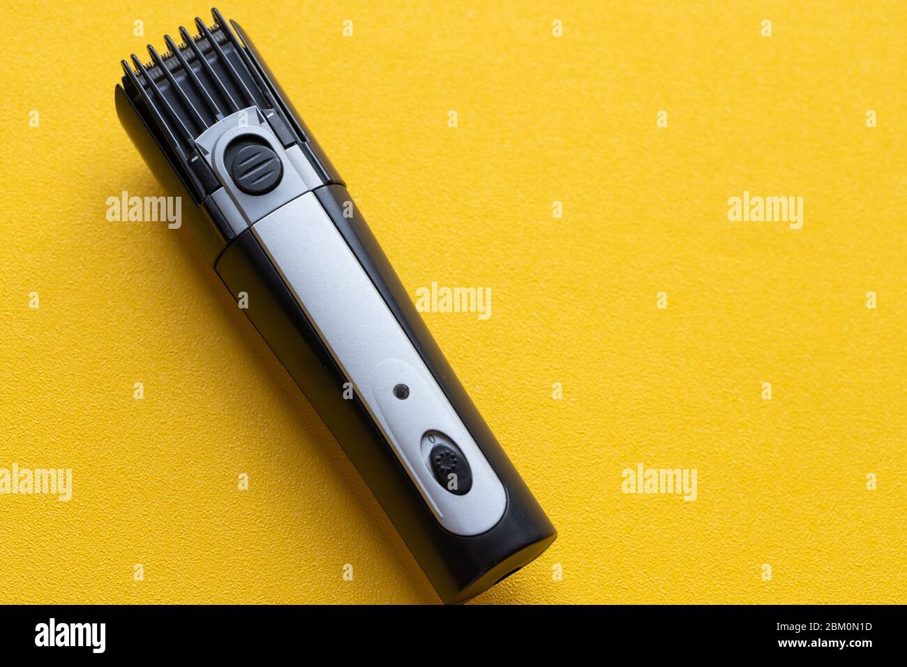 Shaver on a yellow background. The concept of a shaving machine Stock ...
